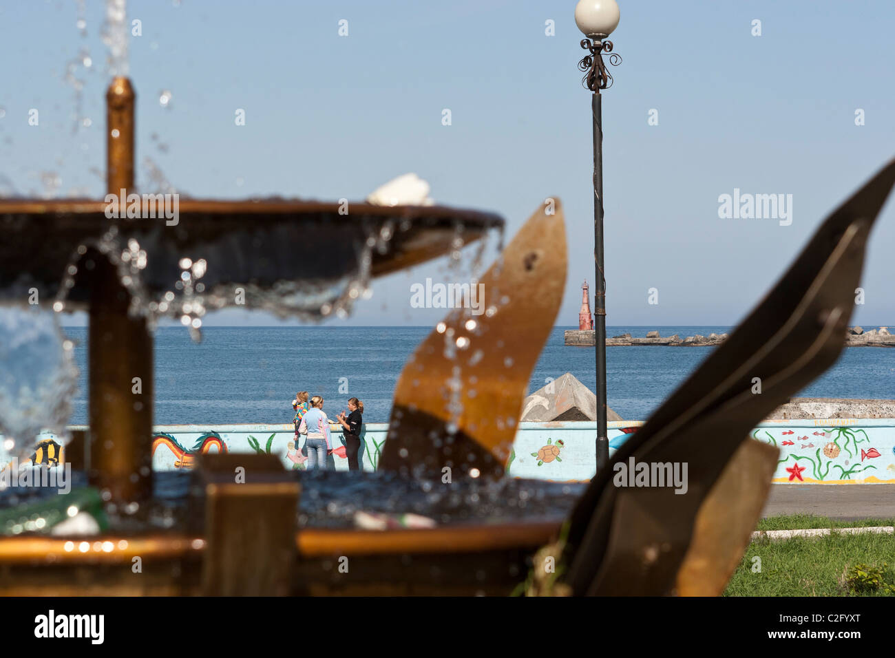 People walk along the waterfront in Kholmsk, Sakhalin, Russia Stock ...