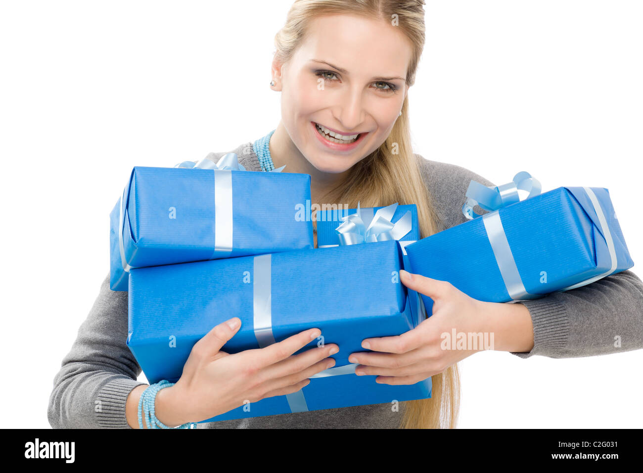 Young happy woman hold blue present with ribbon Stock Photo - Alamy