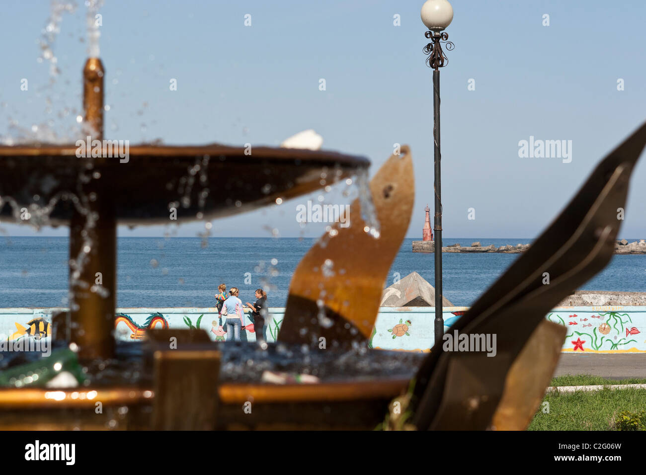 People walk along the waterfront in Kholmsk, Sakhalin, Russia Stock ...