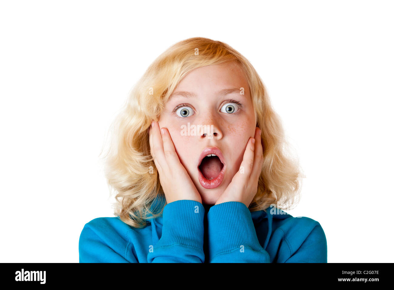 Young beautiful girl looks scared in camera.Isolated on white ...