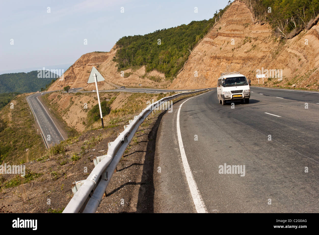 A winding road between Yuzhno- Sakhalinsk and Kholmsk, Sakhalin, Russia ...