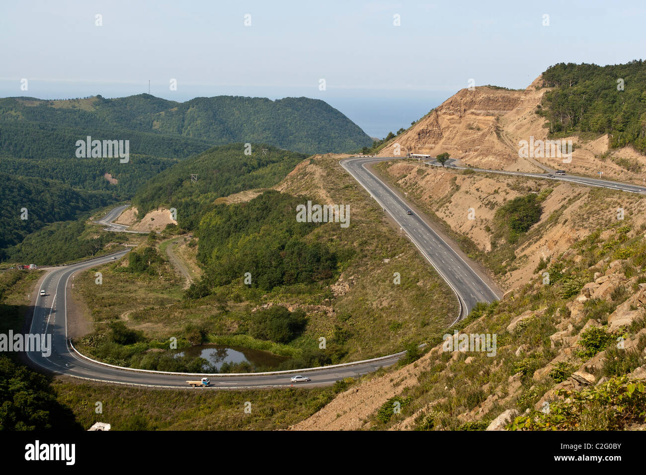 A winding road between Yuzhno- Sakhalinsk and Kholmsk, Sakhalin, Russia ...
