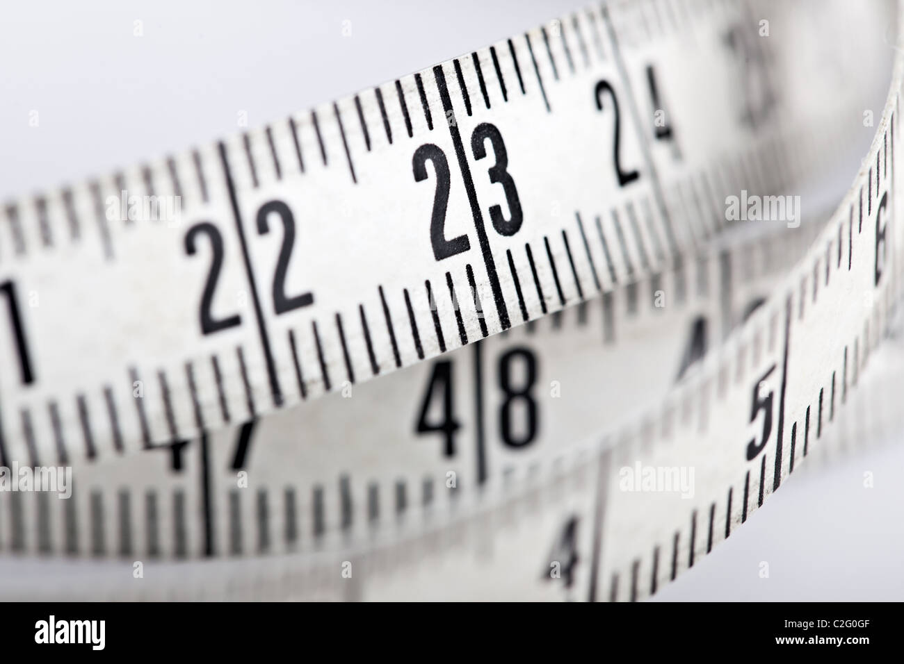 close up of a tape measure rolled on white background Stock Photo - Alamy