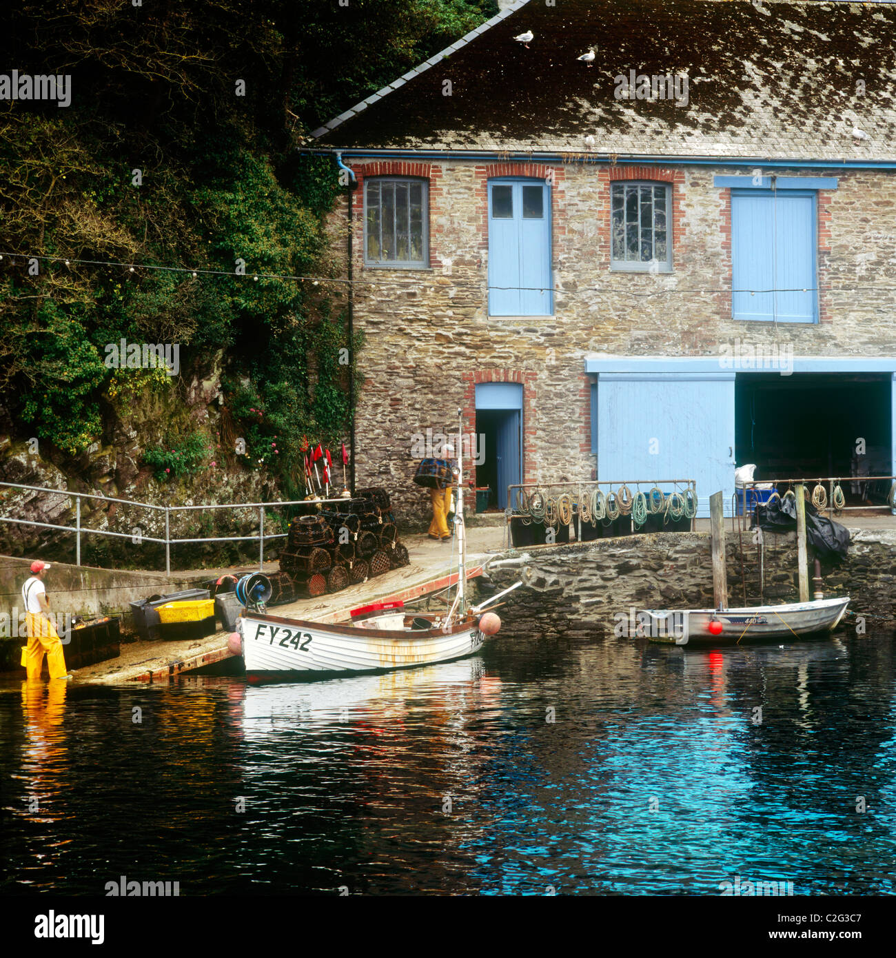 Lobster fishermen working on the quayside at West Looe, Cornwall Stock ...