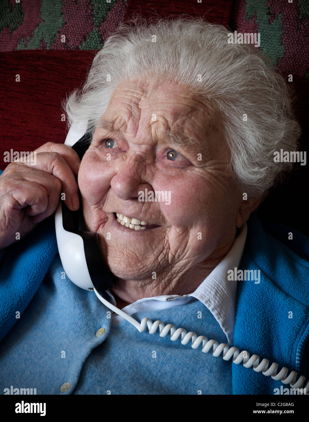 Elderly old age 97 years happy smiling lady with vitality talks on her ...