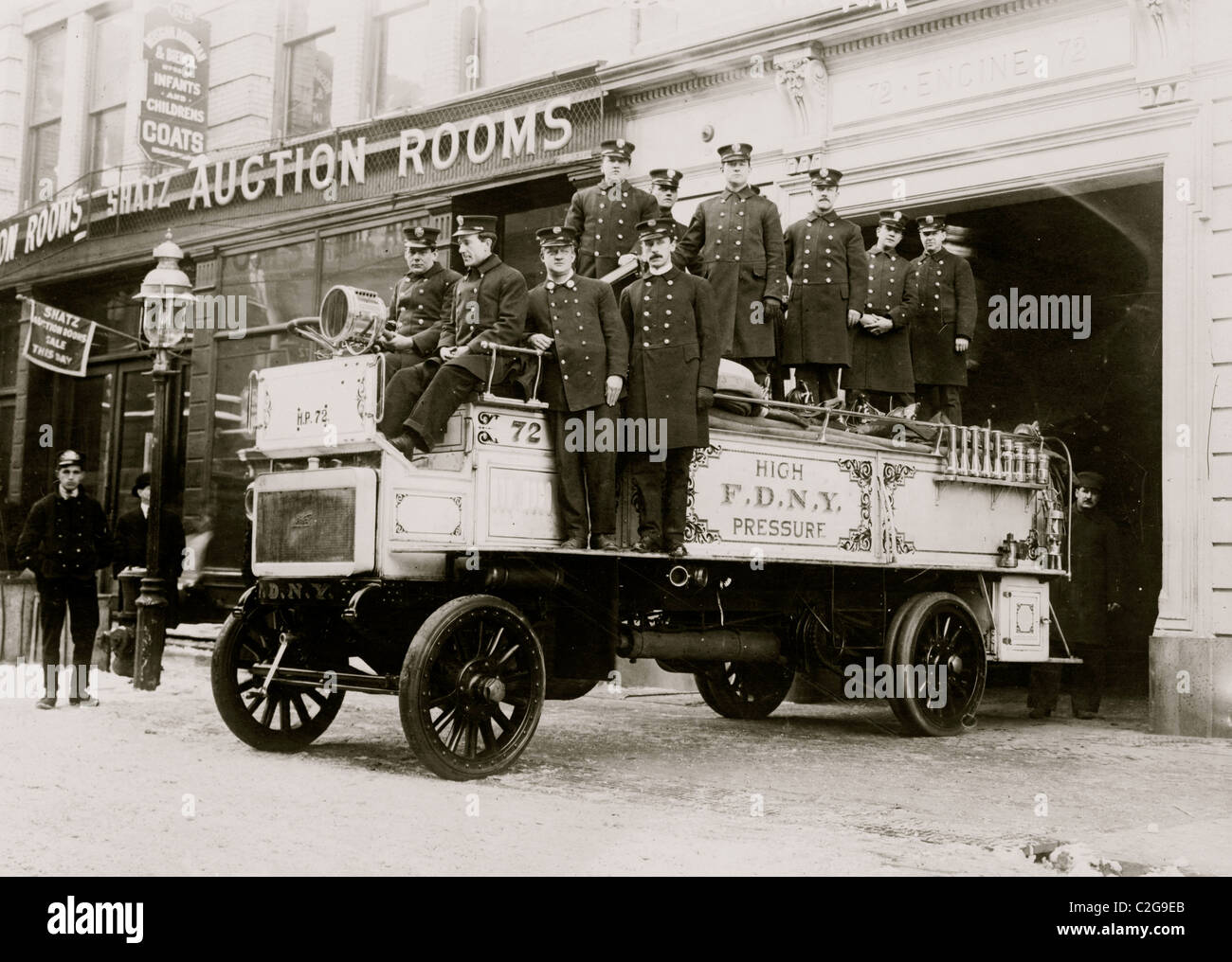 Firemen posed on fire engine, New York City Stock Photo - Alamy