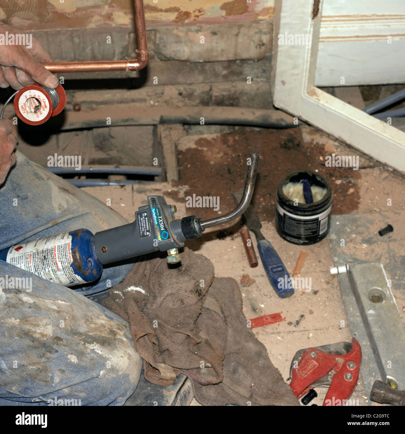 Plumber With Welding Gun And Lubricant Stock Photo - Alamy