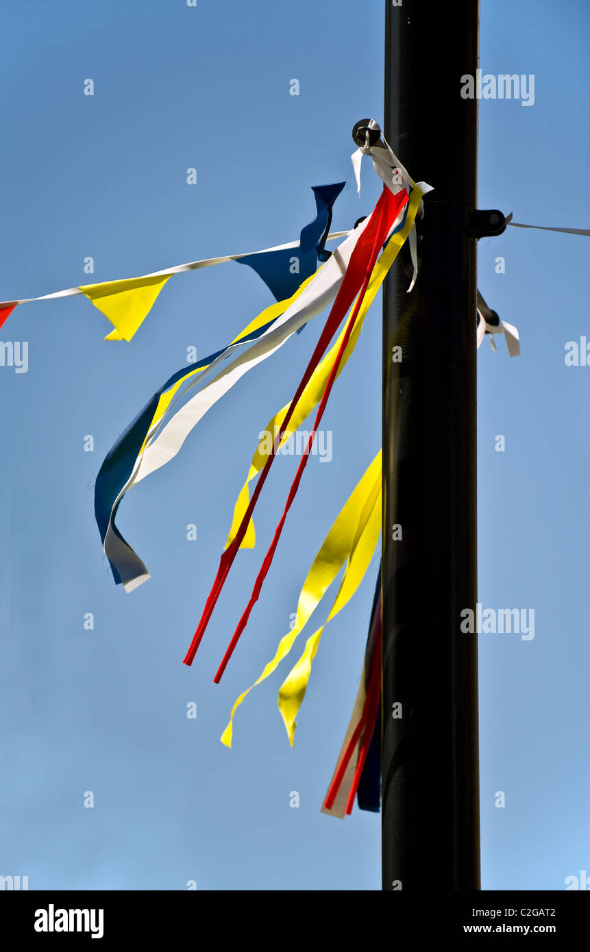 Coulorful ribbons hanging from a pole Stock Photo - Alamy