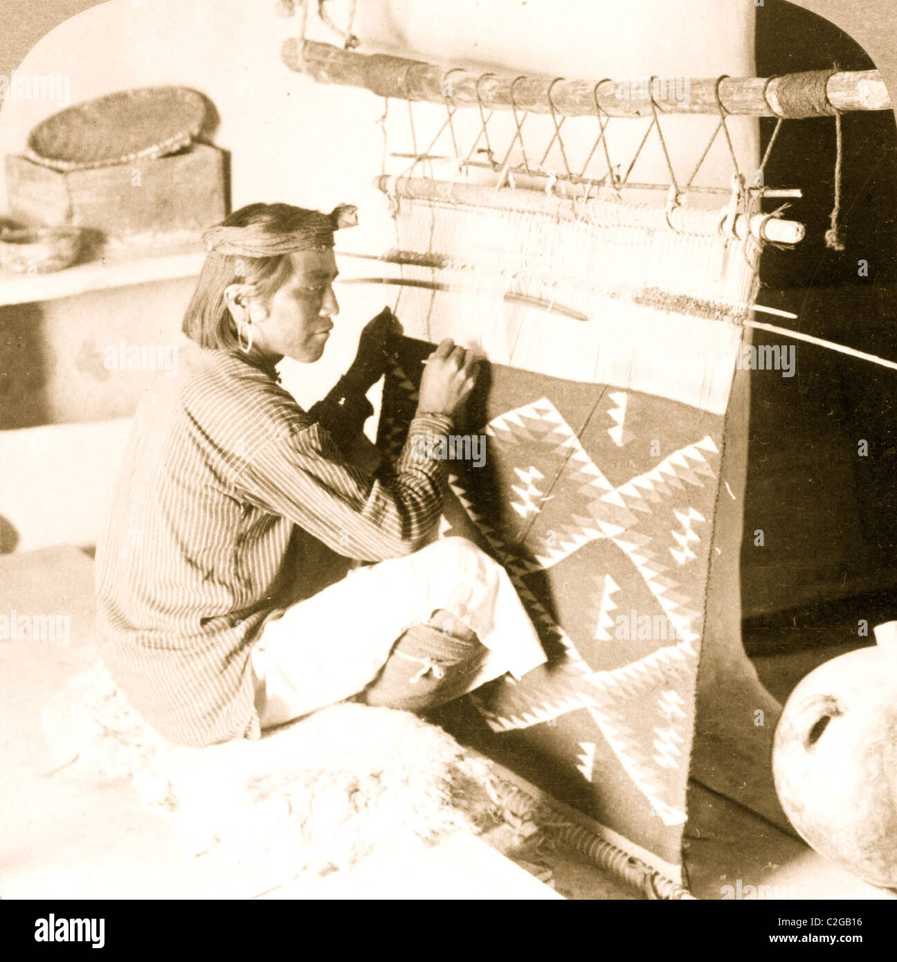 Blanket weaving - a Hopi Indian at work, Wolpei (i.e., Walpi), Arizona ...