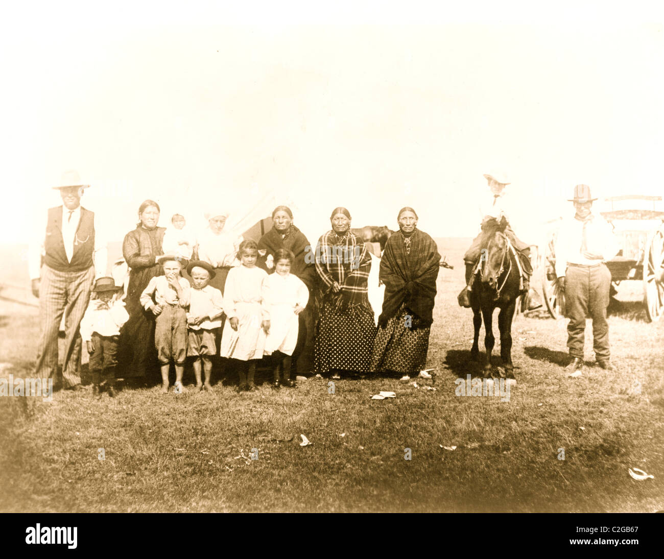 Group of Kickapoo Indians, standing outside tent, dressed in Euro ...