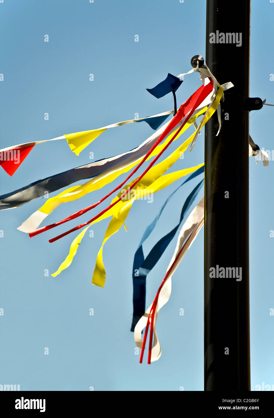 Colourful ribbons hanging from a pole Stock Photo - Alamy
