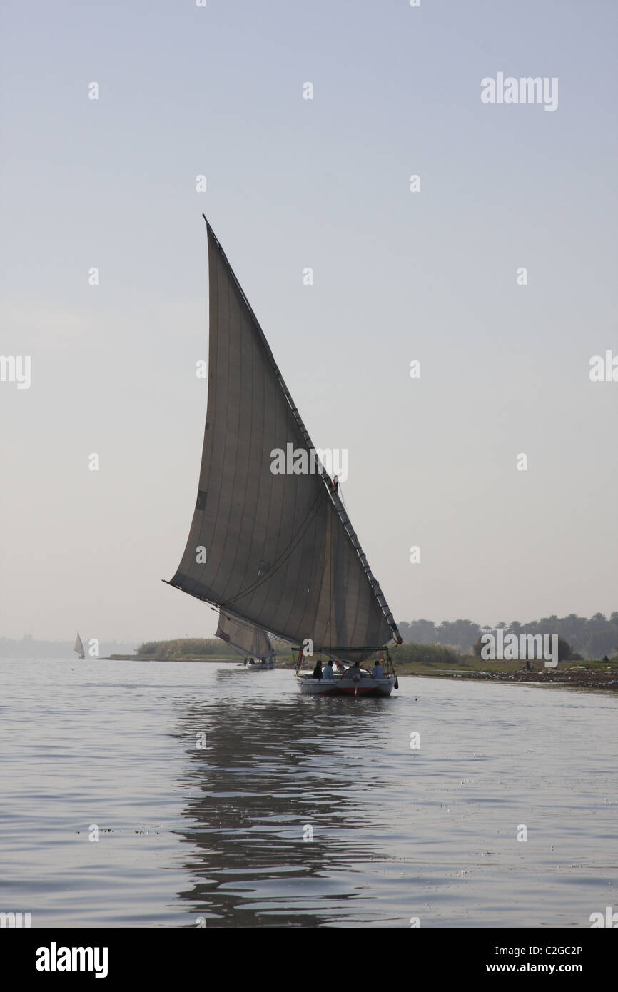 Traditional Egyptian Felucca sailing boat, river Nile Luxor Egypt Stock ...