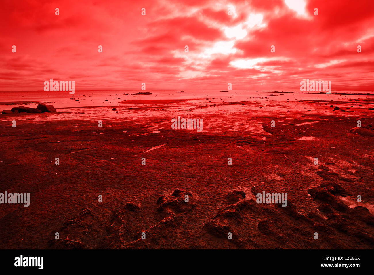 dry ocean under cloudy sky at sunset Stock Photo - Alamy