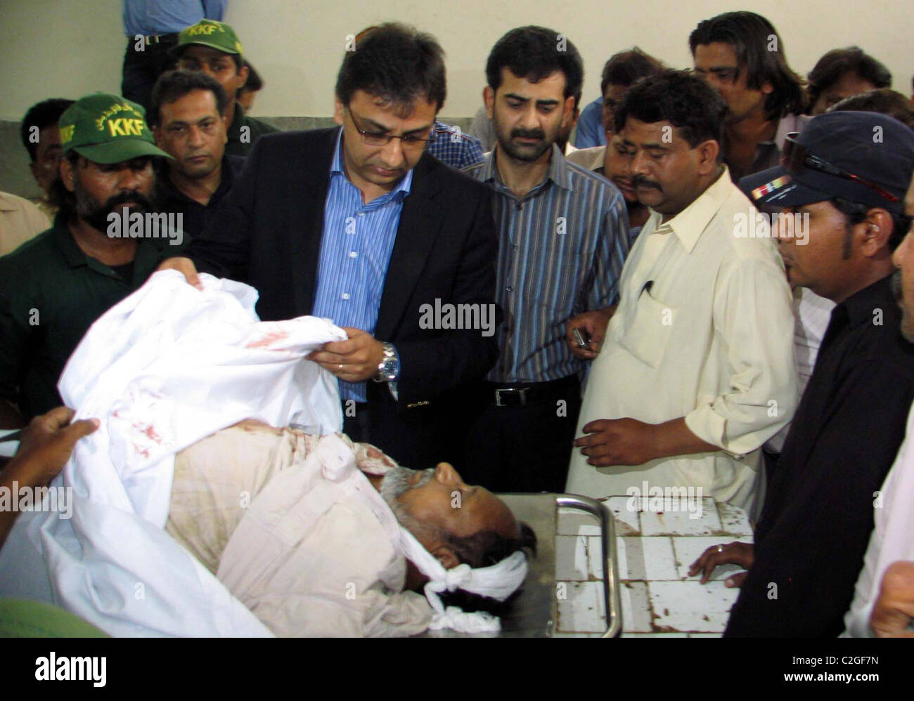 Sindh Information Technology Minister, Raza Haroon looks dead body of a ...