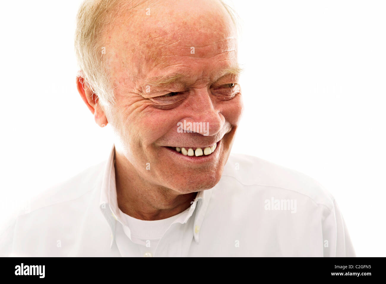 Portrait of a happy senior man smiling over bright background Stock ...