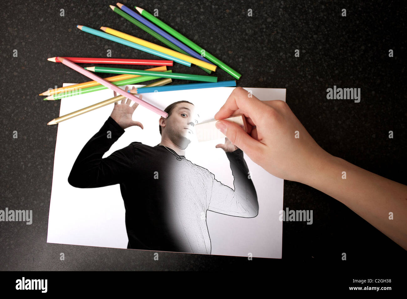 A person rubbing out a man on a piece of paper, created through Adobe ...