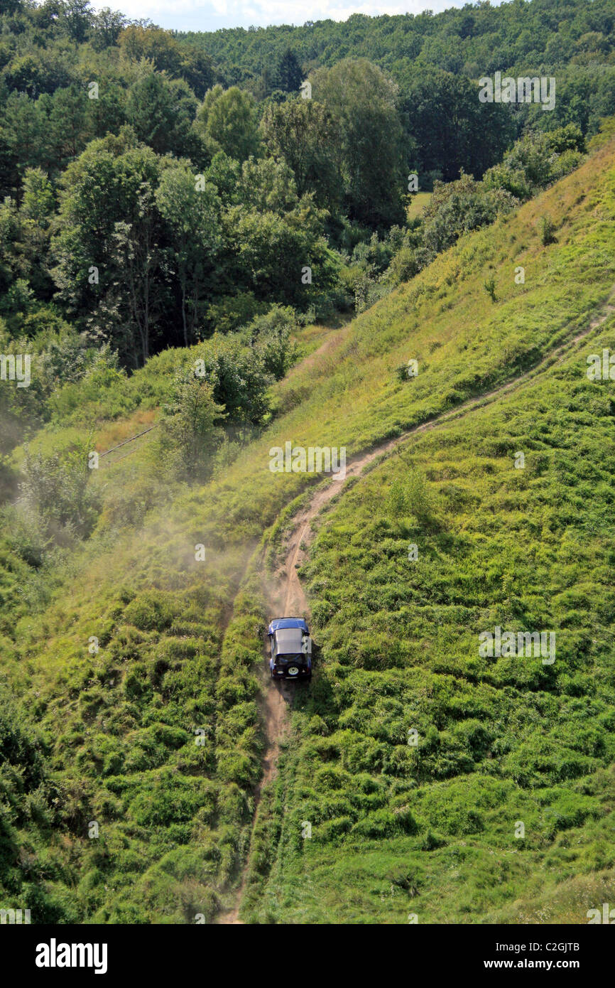 Car climbing up the slope Stock Photo - Alamy