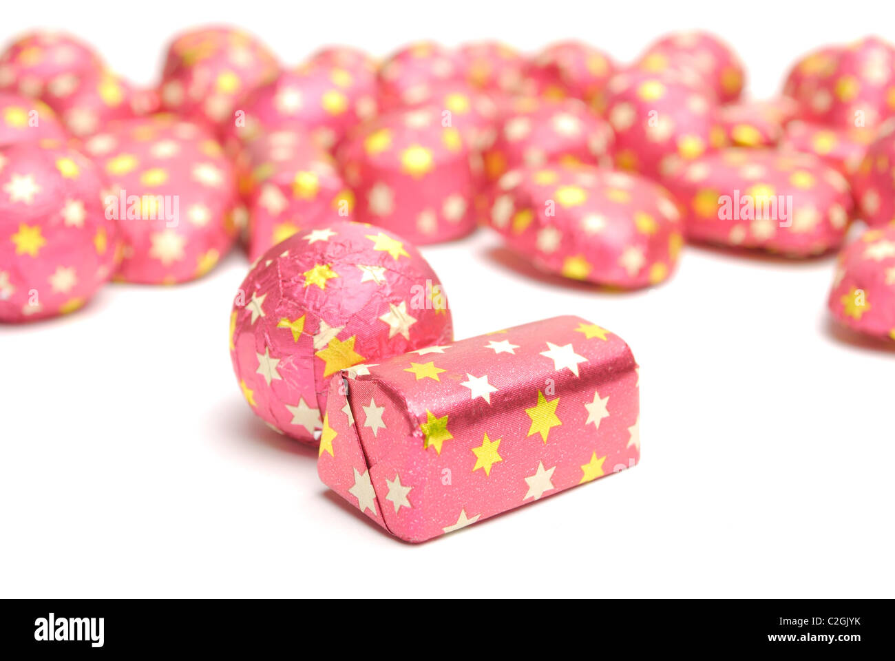 chocolate candies in wrap. Closeup Stock Photo - Alamy