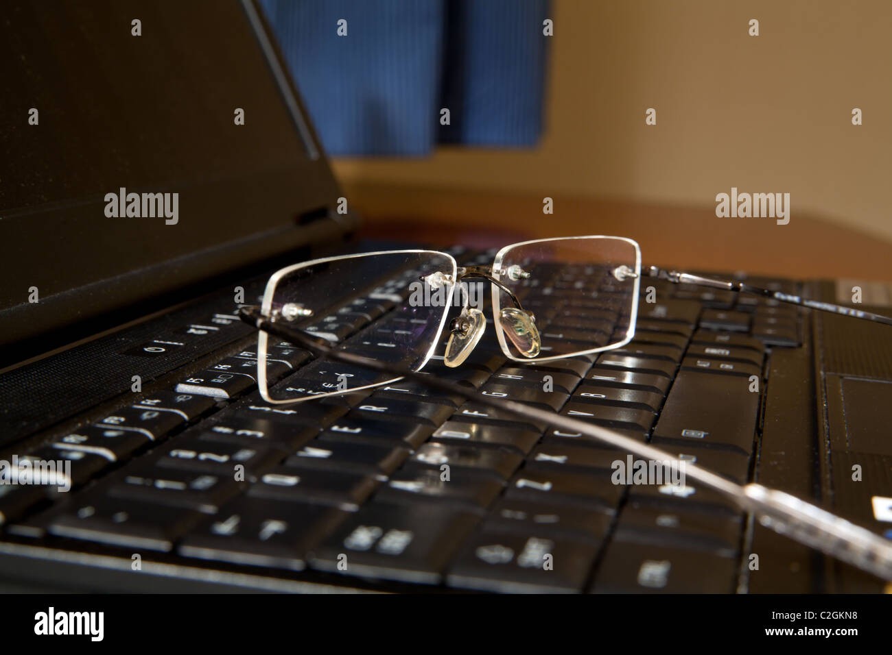 Glasses on laptop Stock Photo - Alamy