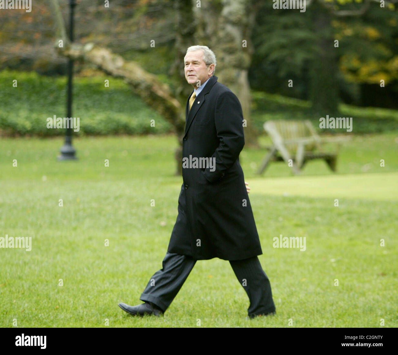 President George Bush leaving The White House with his staff after the ...