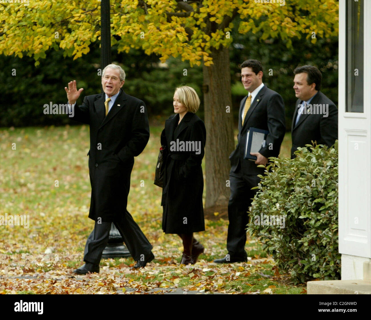 President George Bush leaving The White House with his staff after the ...