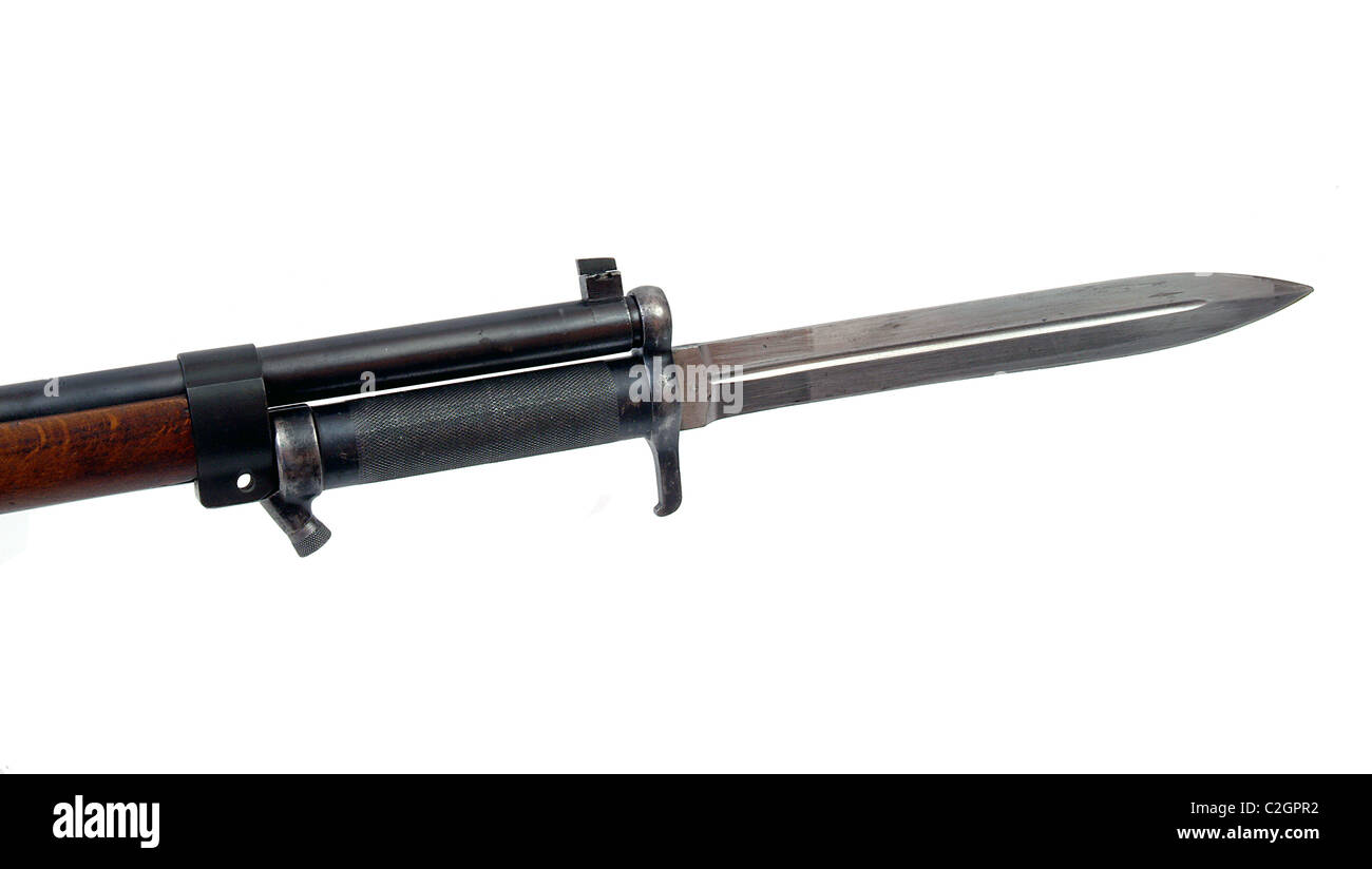Bayonet attack. A bayonet fitted to a Mauser rifle. Swedish model 1896 double edged blade with ...