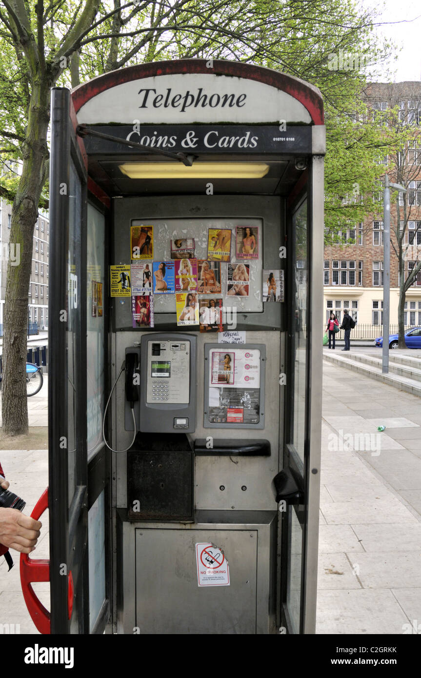 Sex calling cards in a coins and cards telephone booth in London, UK ...