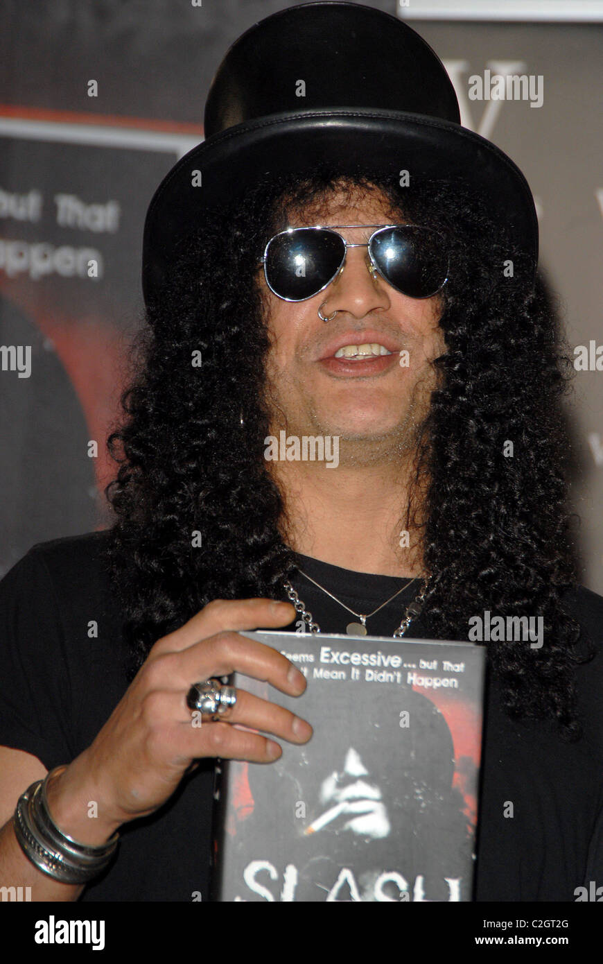 Guns 'N' Roses former lead guitarist Saul 'Slash' Hudson signs copies ...