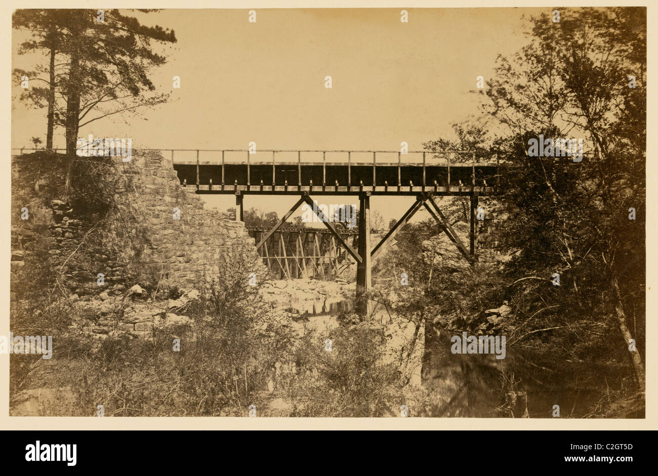Two trestle bridges over a creek Stock Photo - Alamy