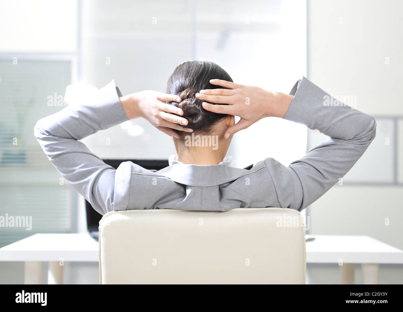 Closeup portrait of cute young business woman from behind Stock Photo ...