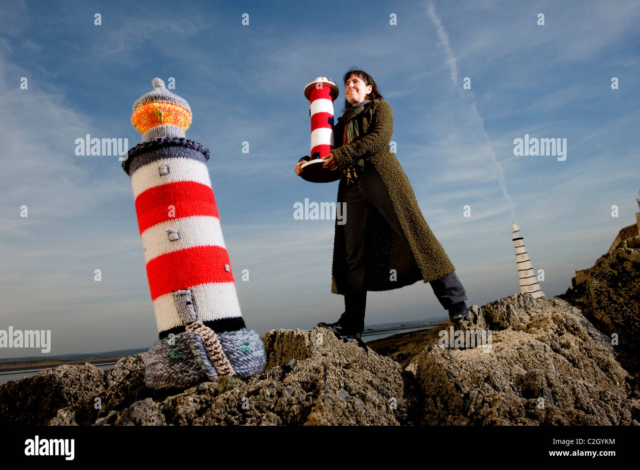 Textile artist Alison Murray with her knitted lighthouses part of ...