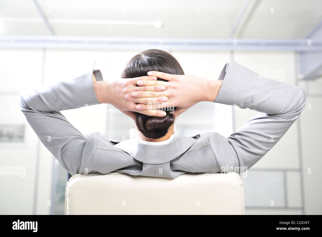 Closeup portrait of cute young business woman from behind Stock Photo ...