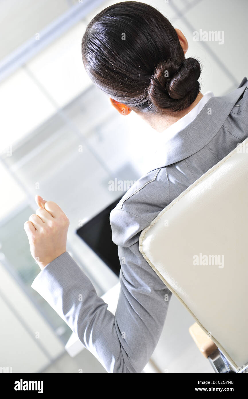 Closeup portrait of cute young business woman from behind Stock Photo ...