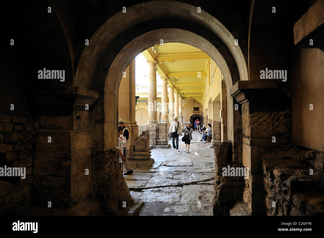 One of the many arched tunnels around the Roman baths in historic city ...
