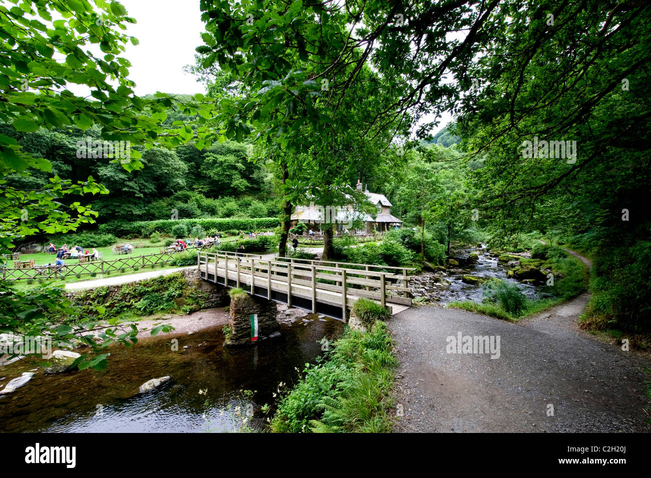 A footbridge crossing the river Lyn to the tearoom at Watersmeet ...