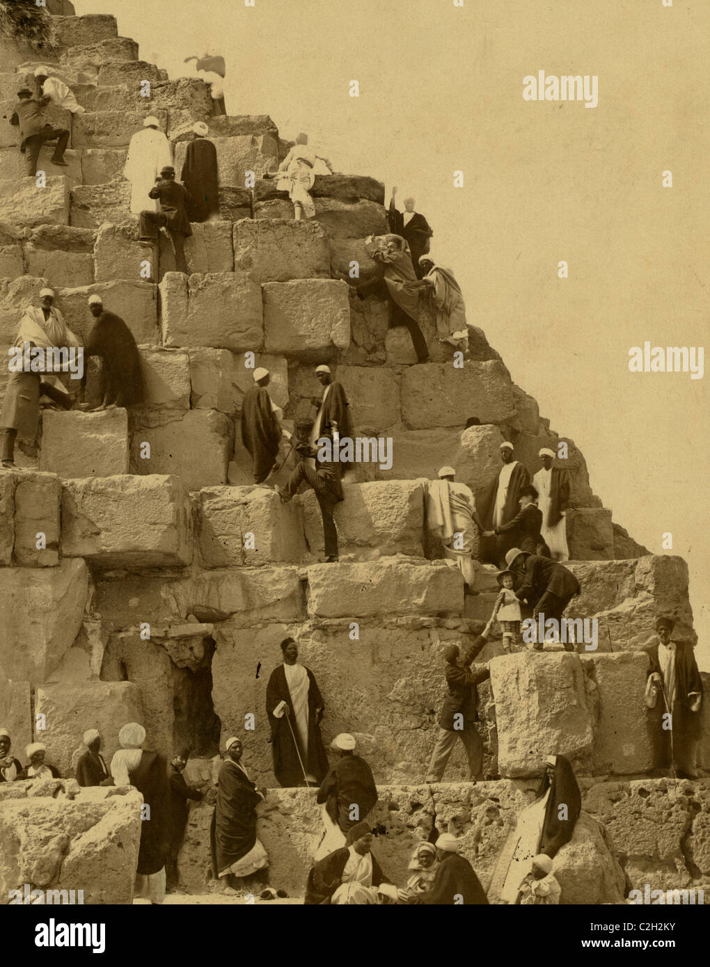 Several people gathered at the base of the Great Pyramid, others ...