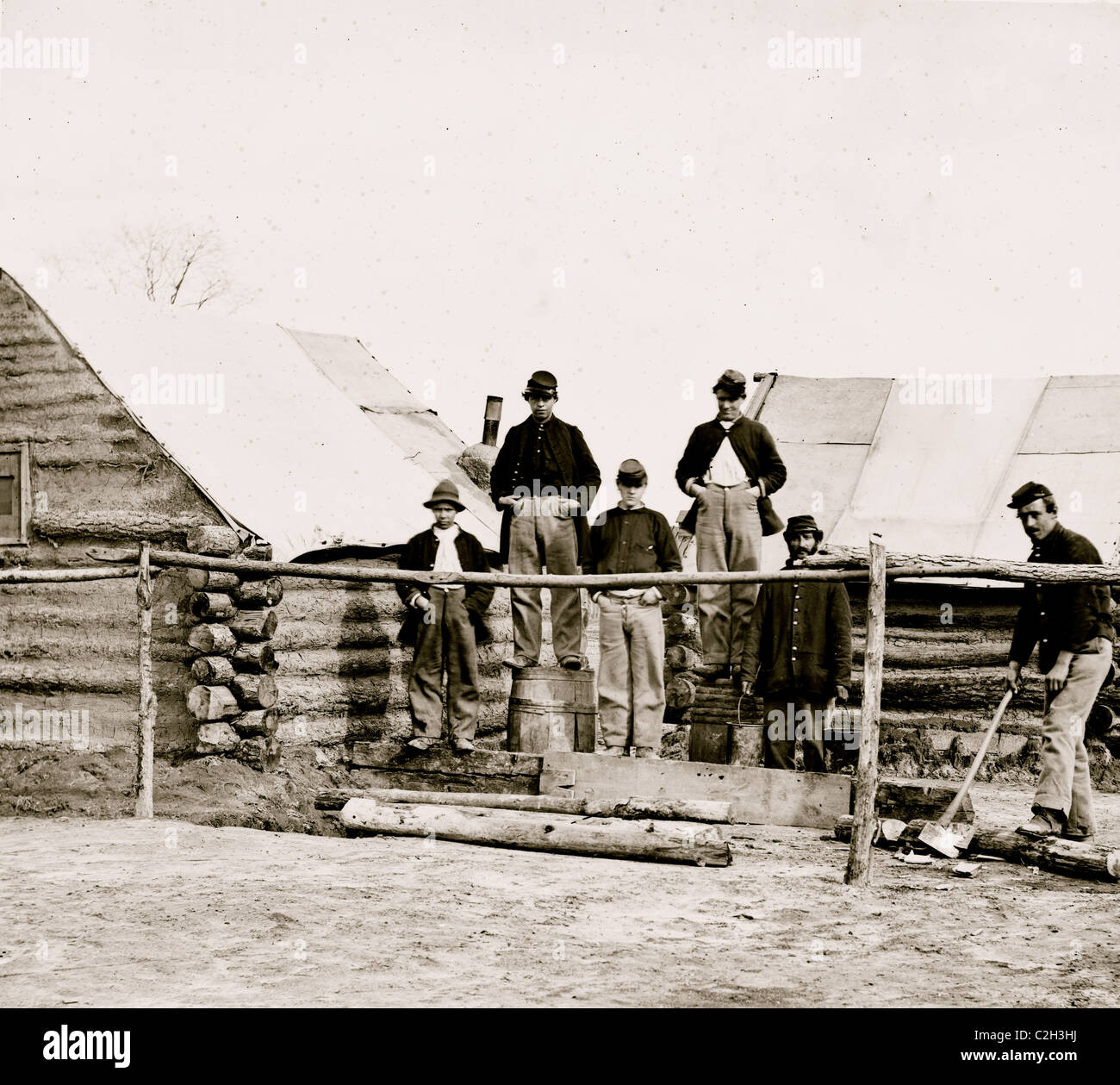 Soldier chopping wood in camp Stock Photo - Alamy