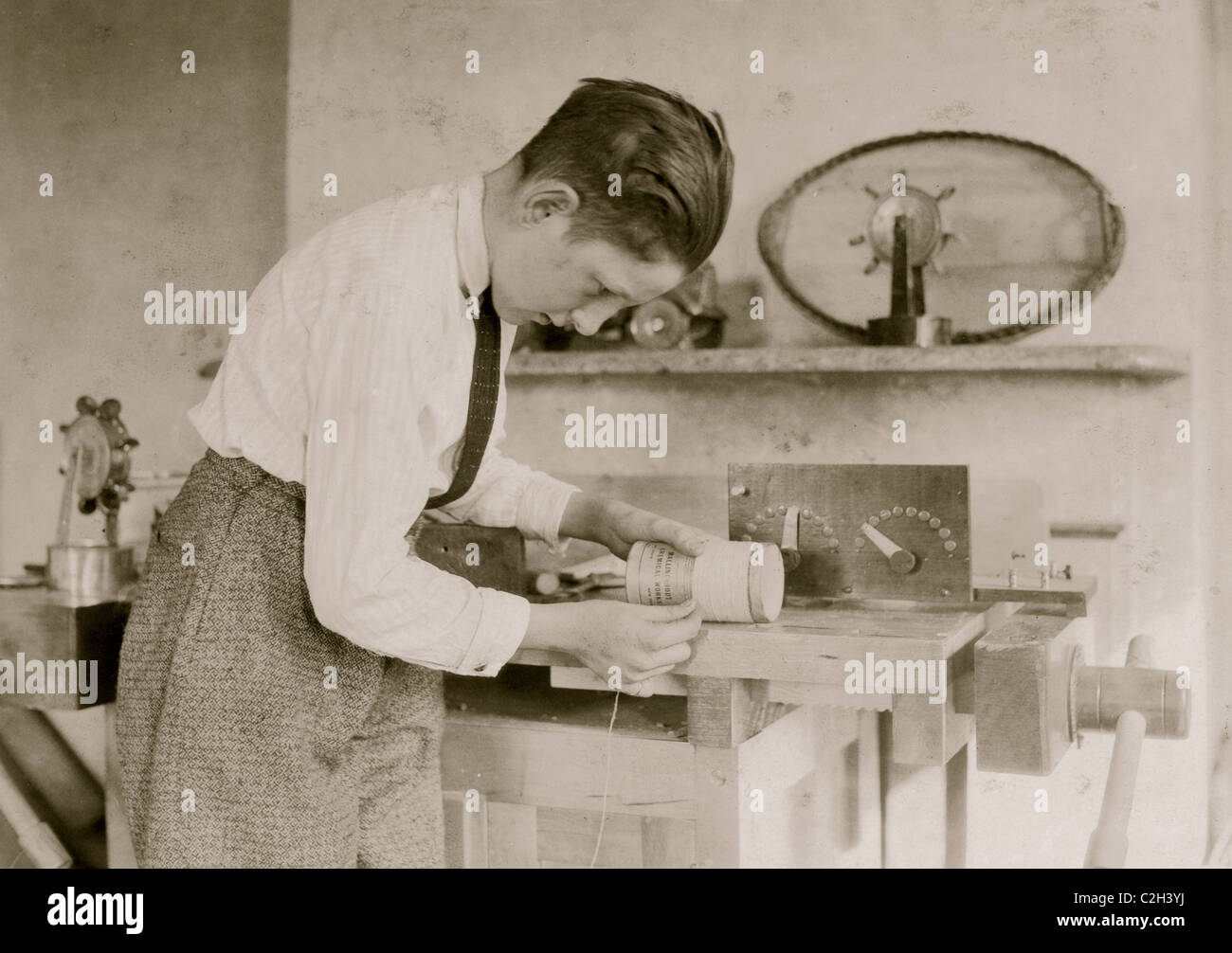 Boy at work on coil Stock Photo - Alamy