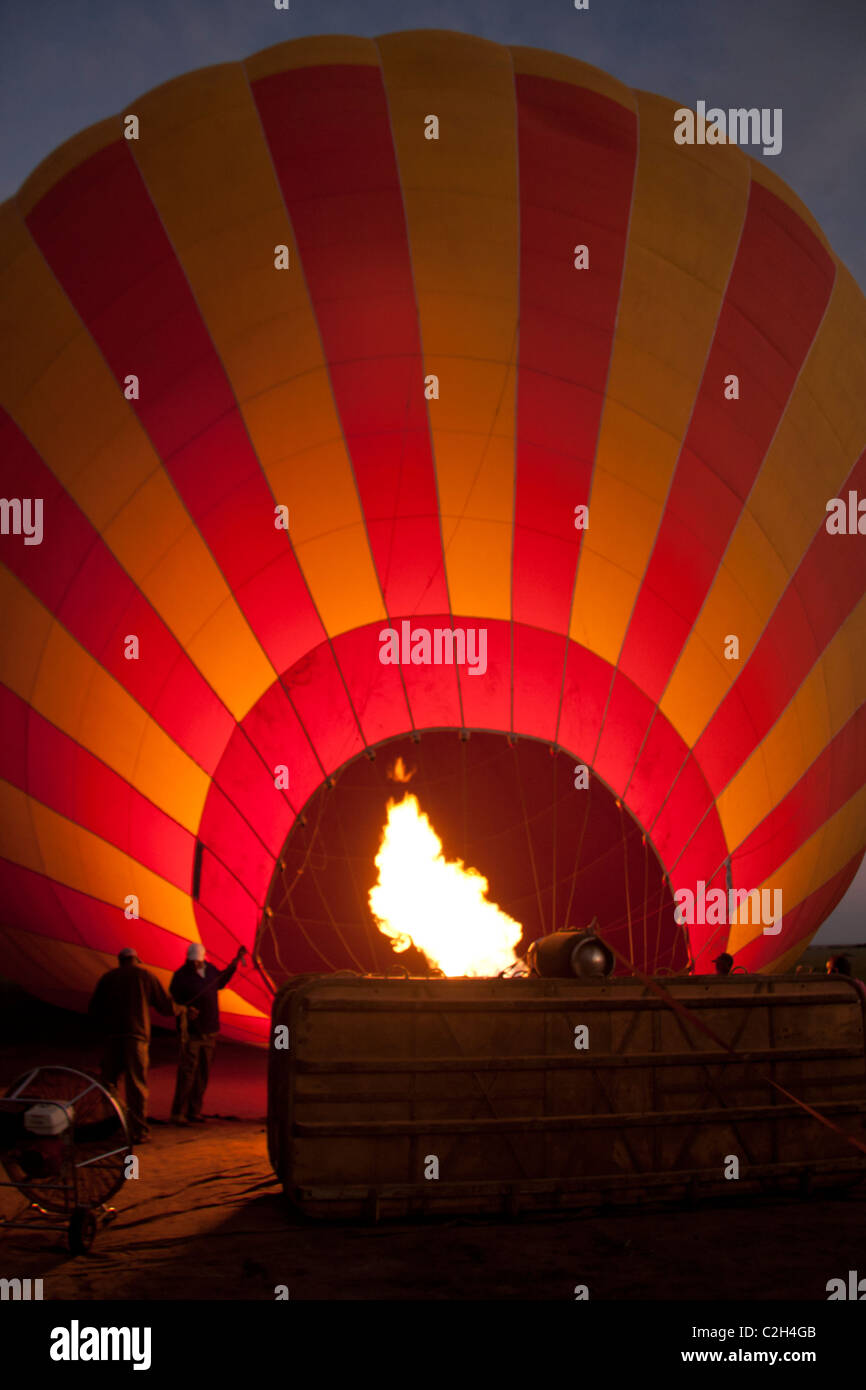 Hot air balloon being inflated on the Masai Mara at dawn Stock Photo ...