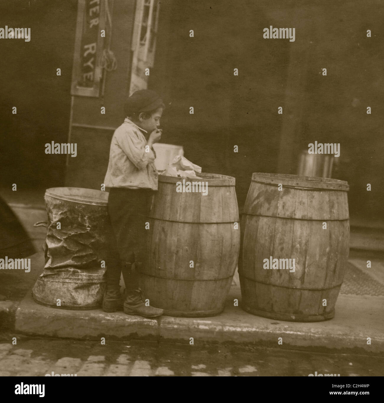 Patching Up a Meal from a Barrel Boston Slums Stock Photo - Alamy