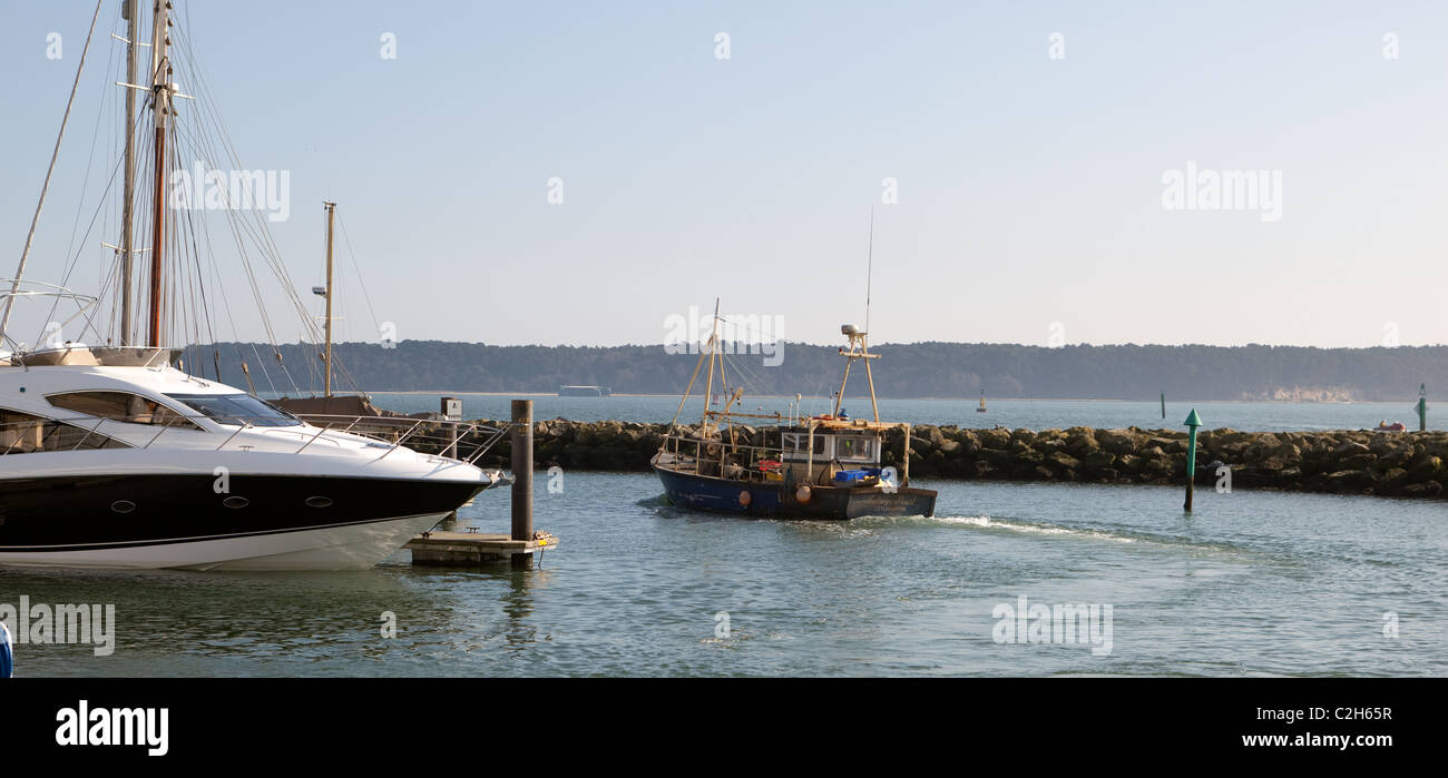Fishing boat arriving Poole Harbour . Dorset South coast of England ...