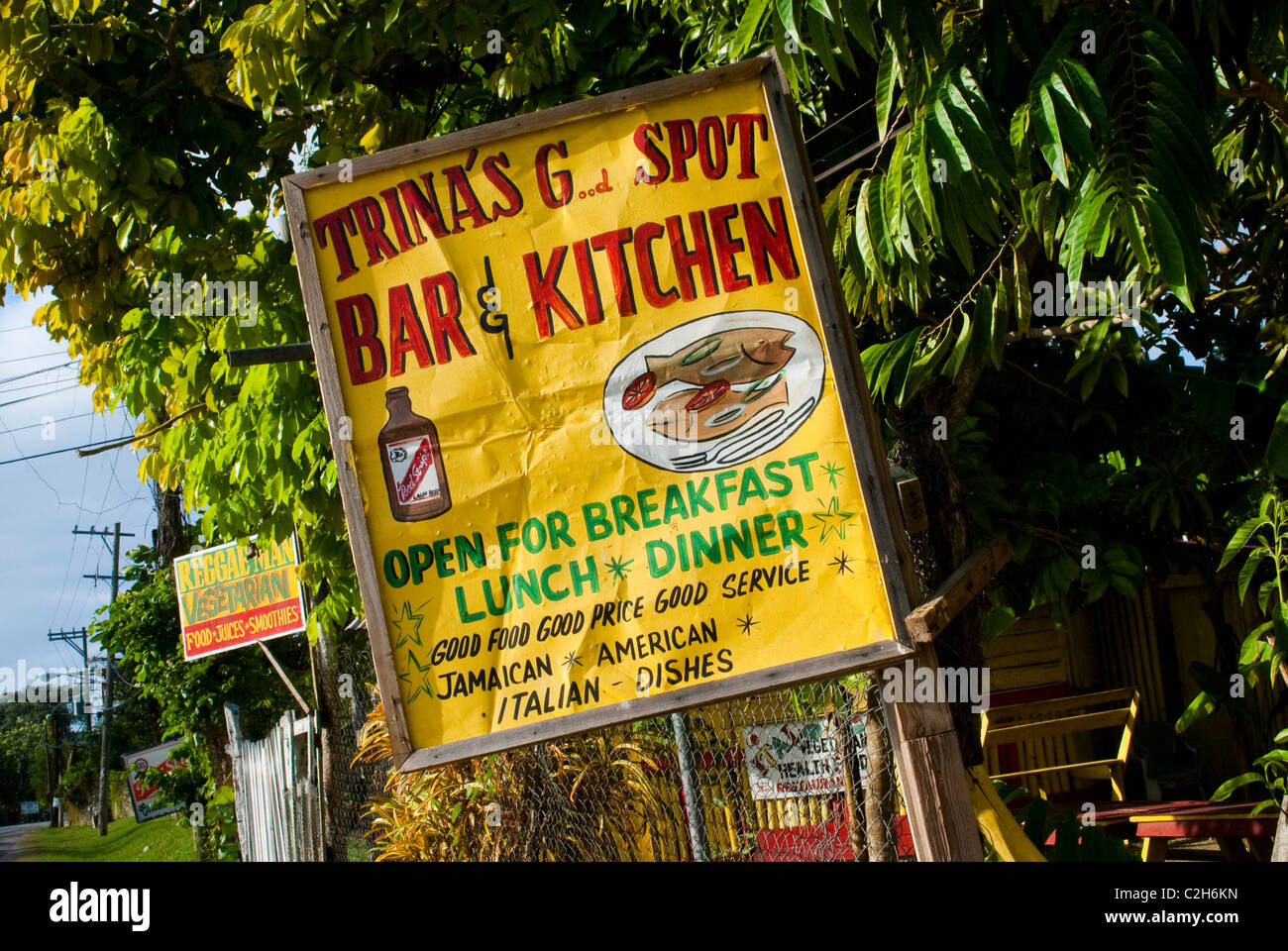 Colorful restaurant & bar sign on Norman Manley Blvd in the Long Bay ...