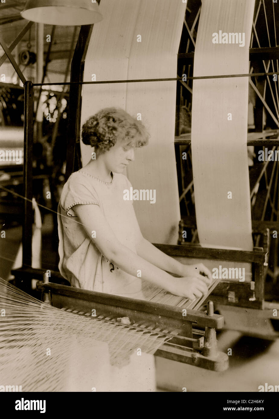 Girl works at Silk Thread machine Stock Photo - Alamy