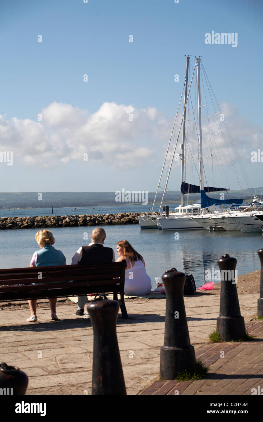Sat enjoying the views over Poole Harbour in August Stock Photo - Alamy