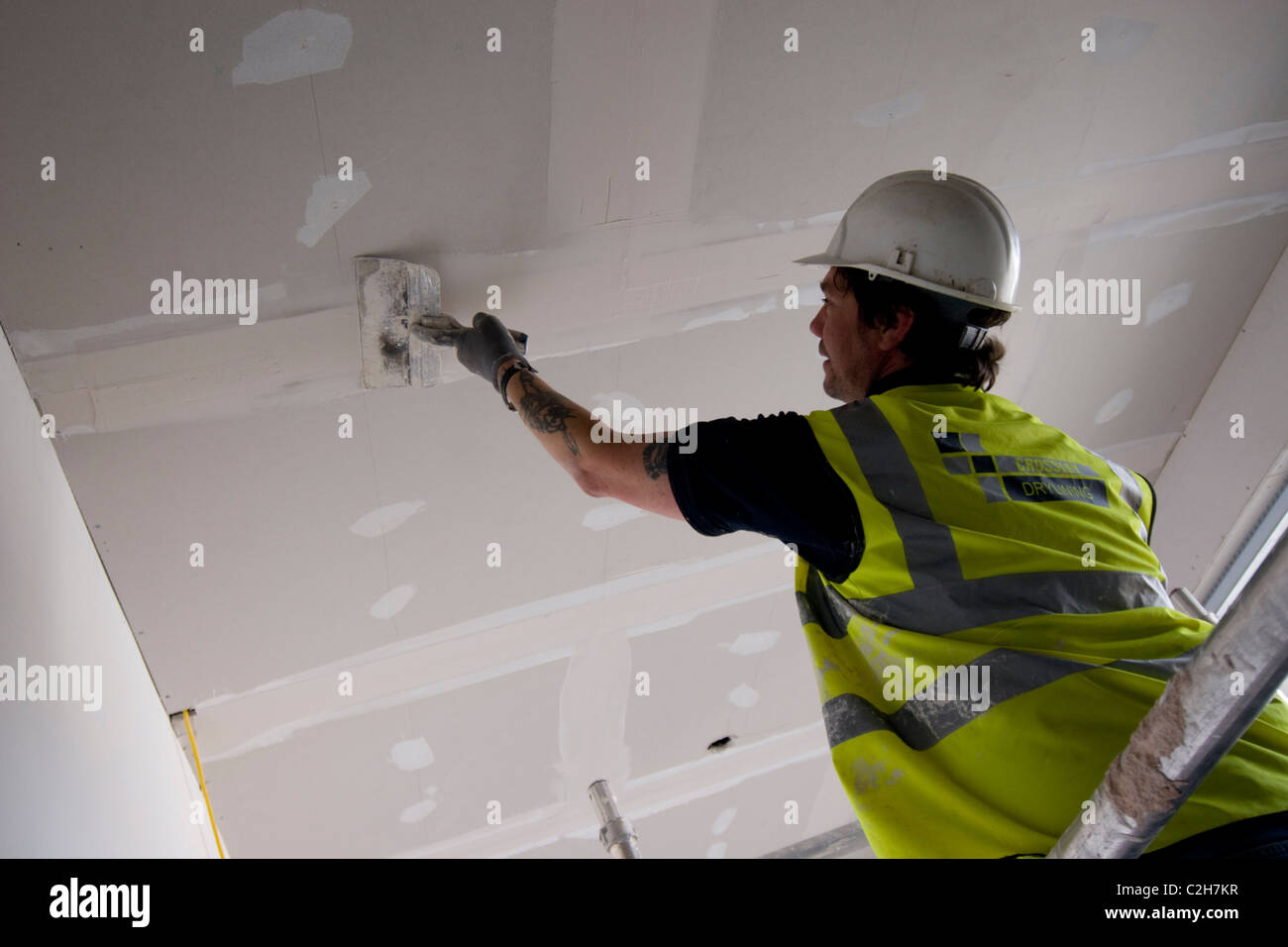 Plastering a ceiling in a school Stock Photo - Alamy