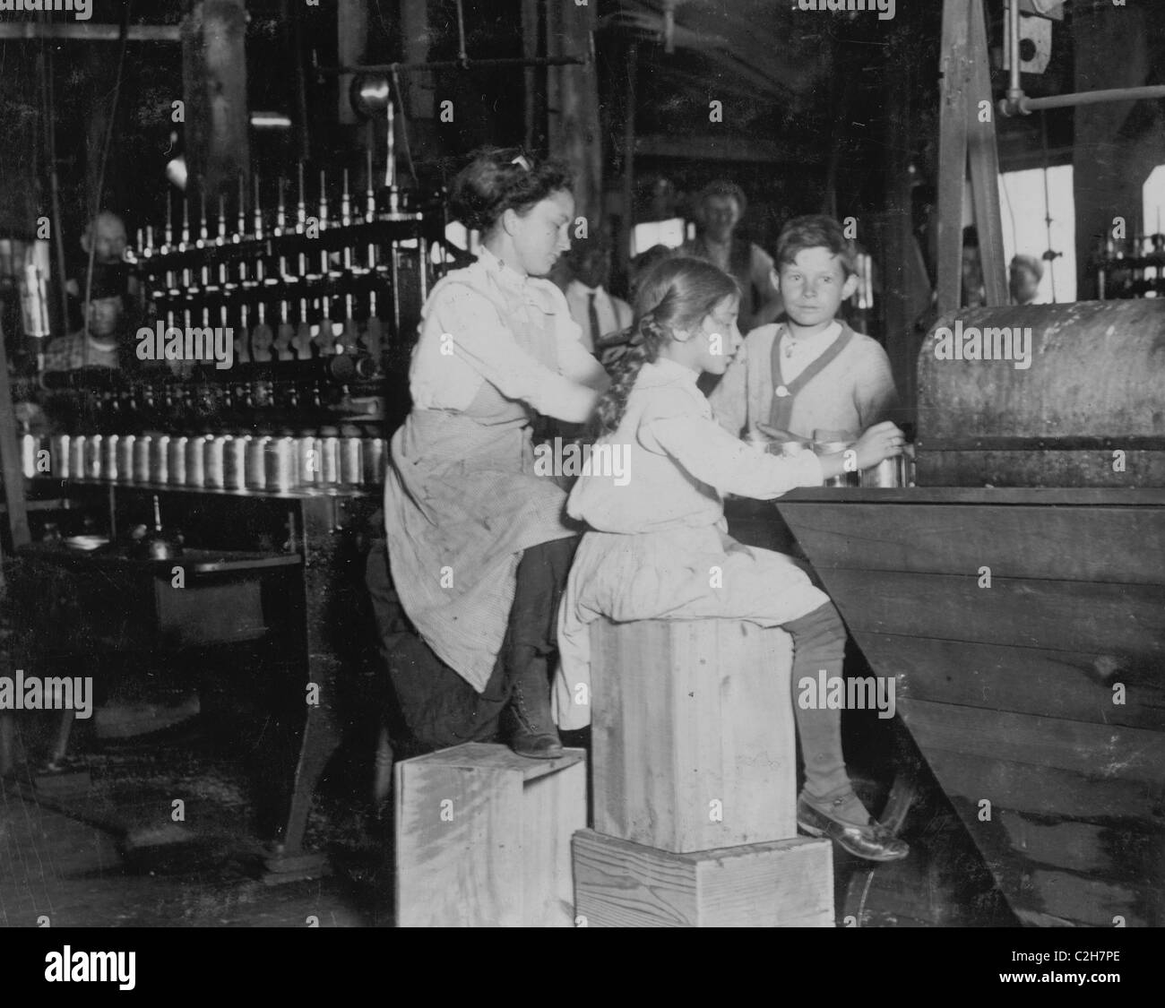 8 year old works in Ross' canneries. She helps at the capping machine ...
