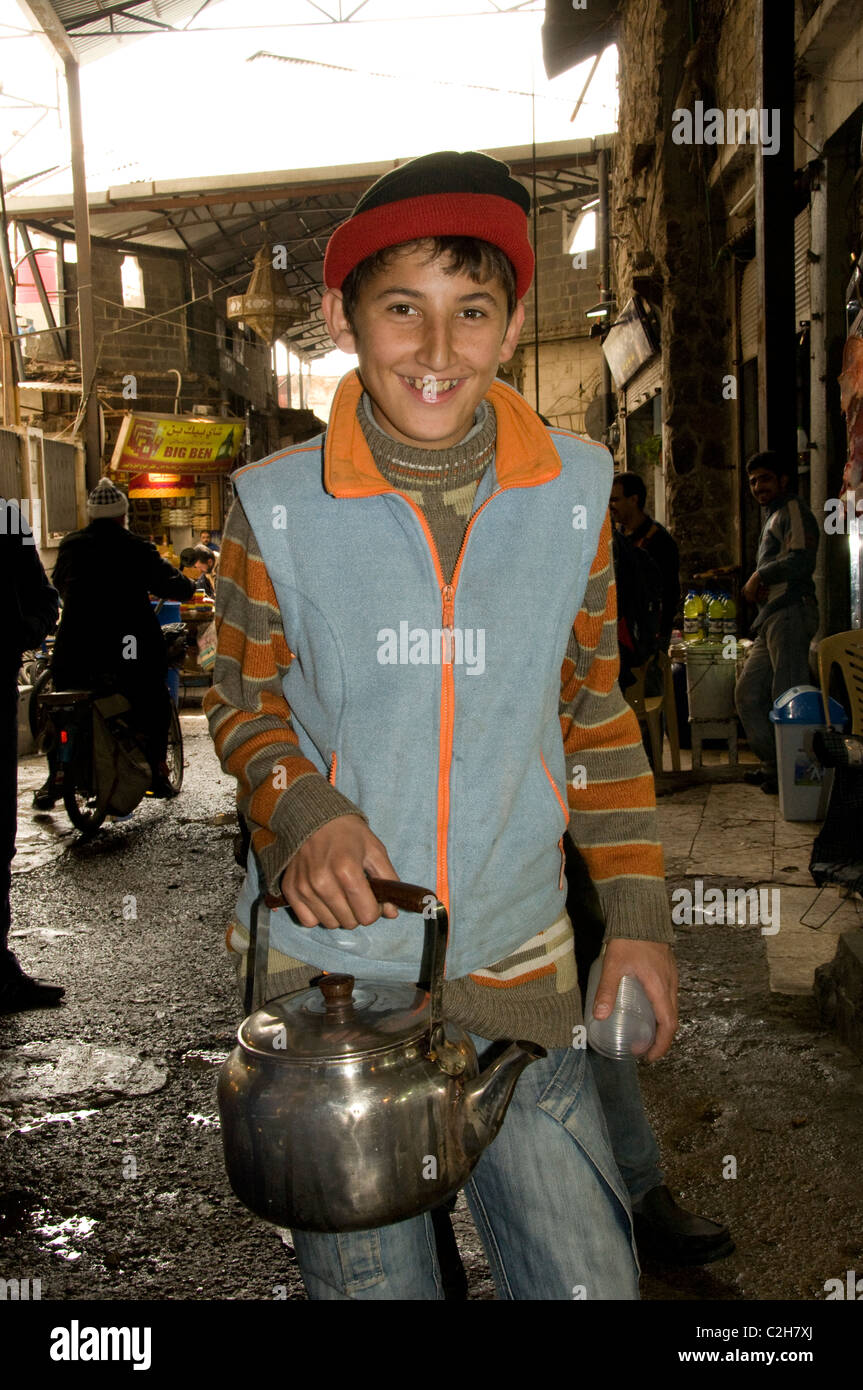 Homs Syria teapot kettle tea pot young boy market Stock Photo - Alamy