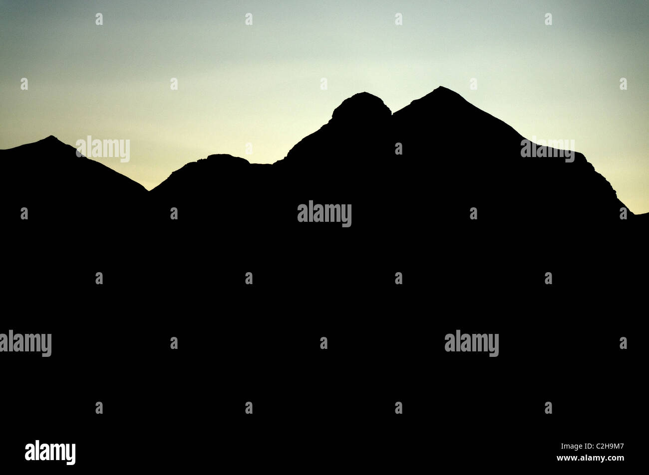 Black outline silhouette of jagged mountains silhouetted mountain ridge ...