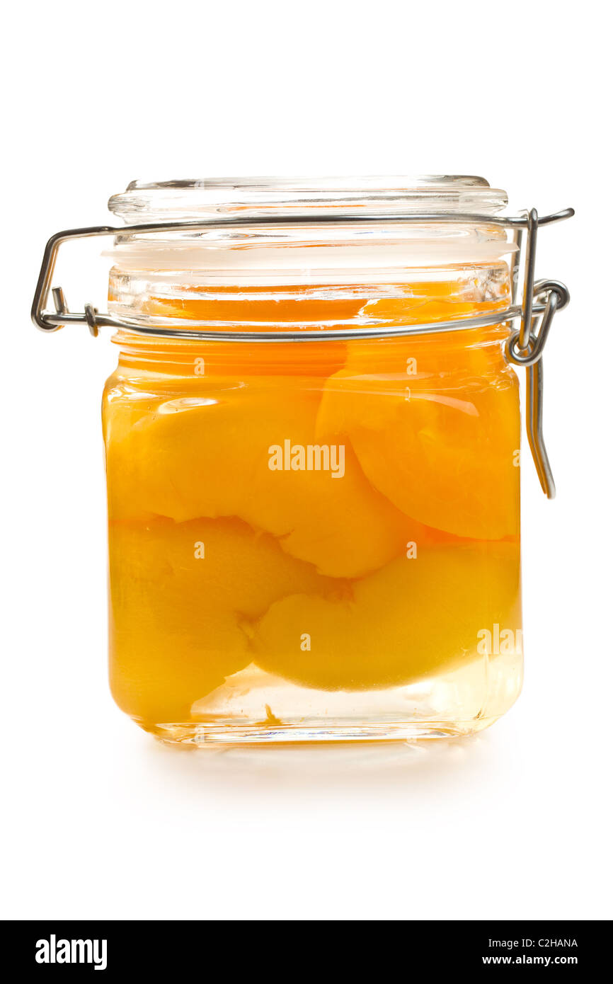 canned peach in glass jar on white background Stock Photo - Alamy