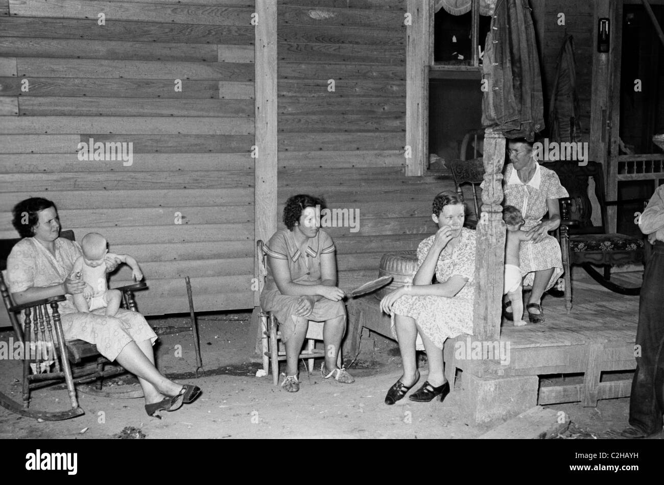 Family of Poor Farmers on Porch Stock Photo - Alamy
